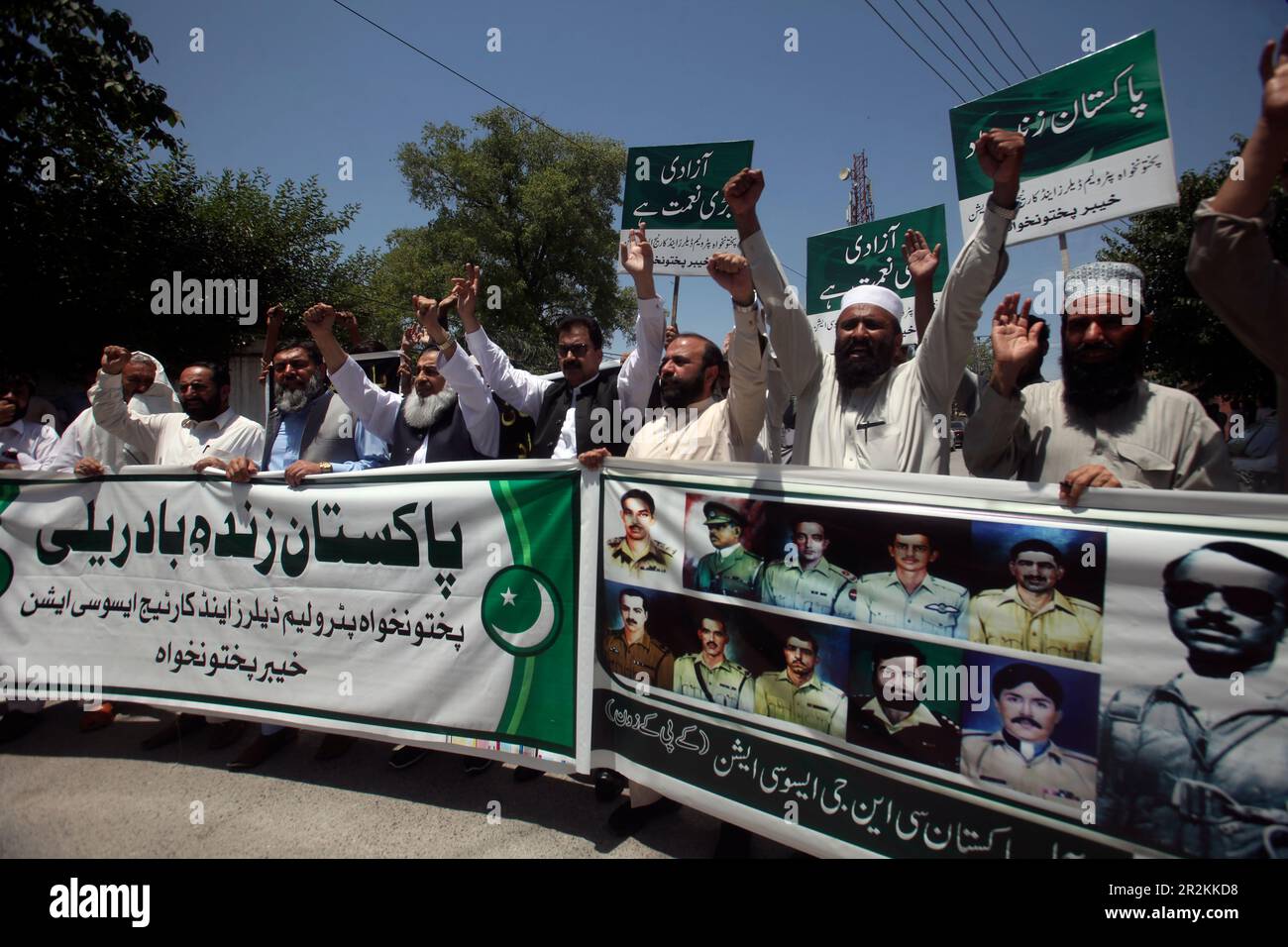 People take part in a rally to show solidarity with Pakistan's army in ...