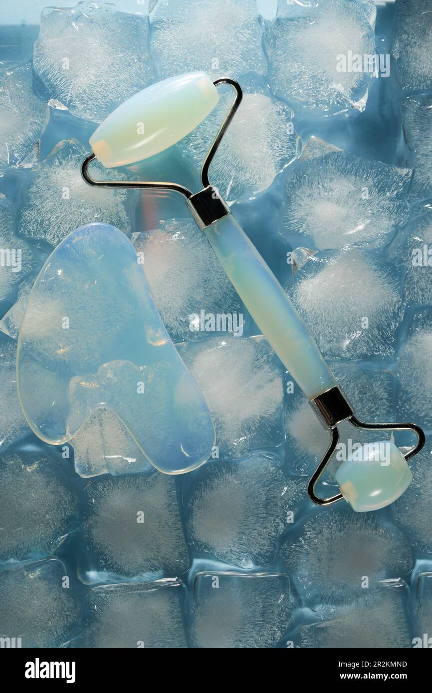 Blue jade face roller and Gua Sha scraping for beauty facial massage ...