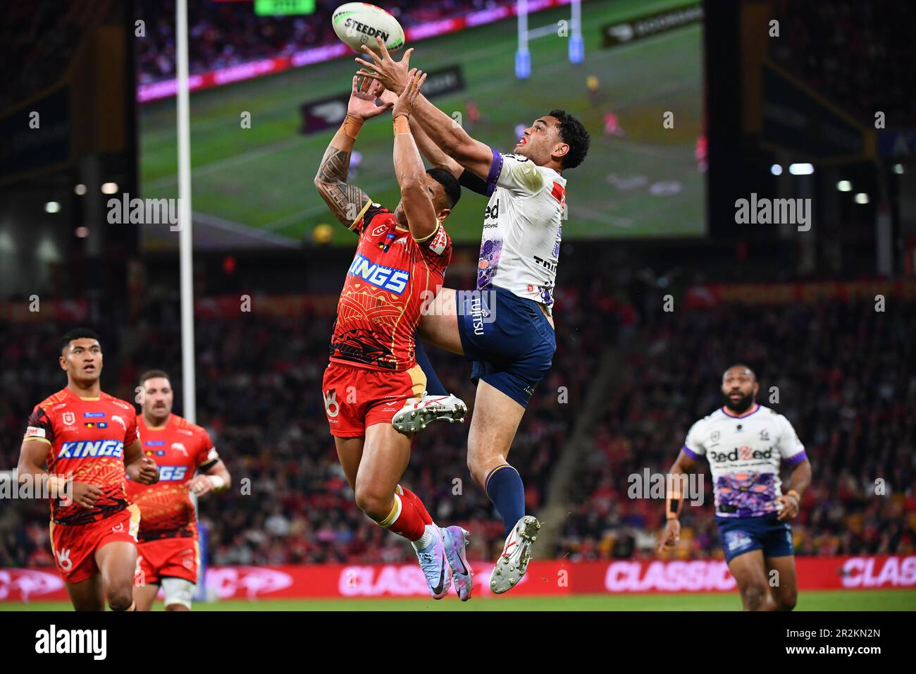 Jamayne Isaako of the Dolphins competes with Xavier Coates of the Storm ...