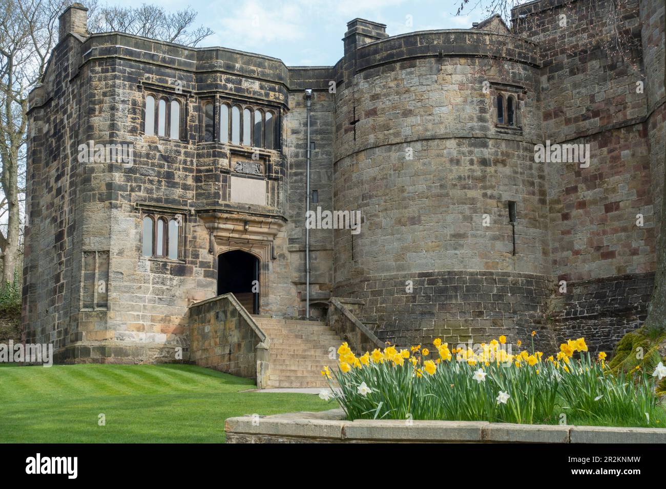 Entrance to Medieval Keep with daffodils in foreground at Skipton ...