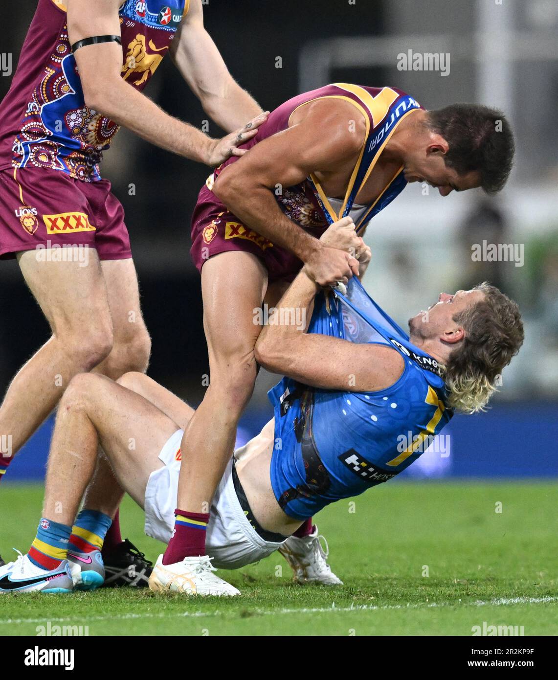 Brandon Starcevich (centre) of the Lions is seen in a scuffle with Nick ...