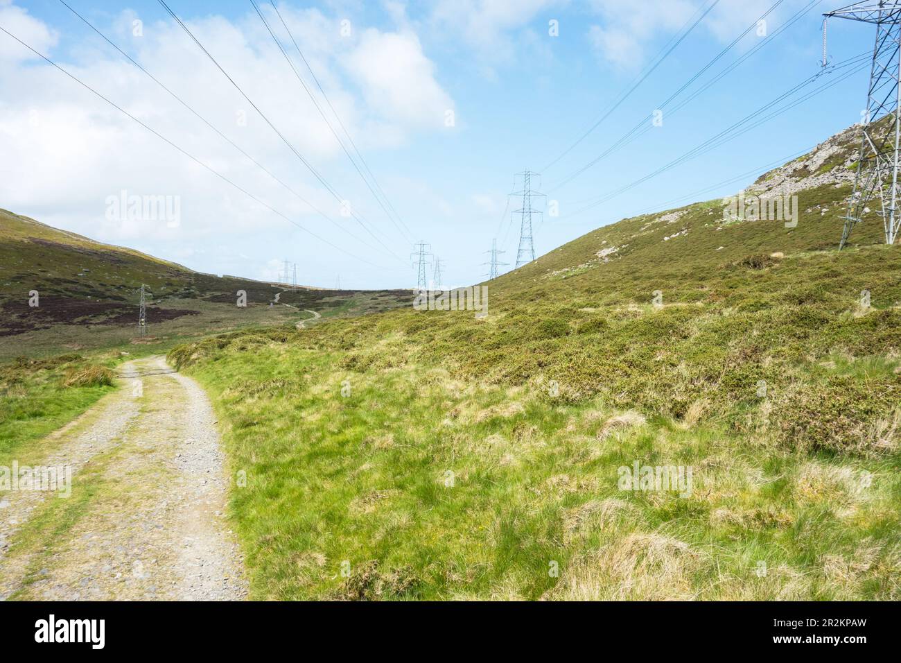 Electricity pylons running down a welsh mountain valley Stock Photo - Alamy