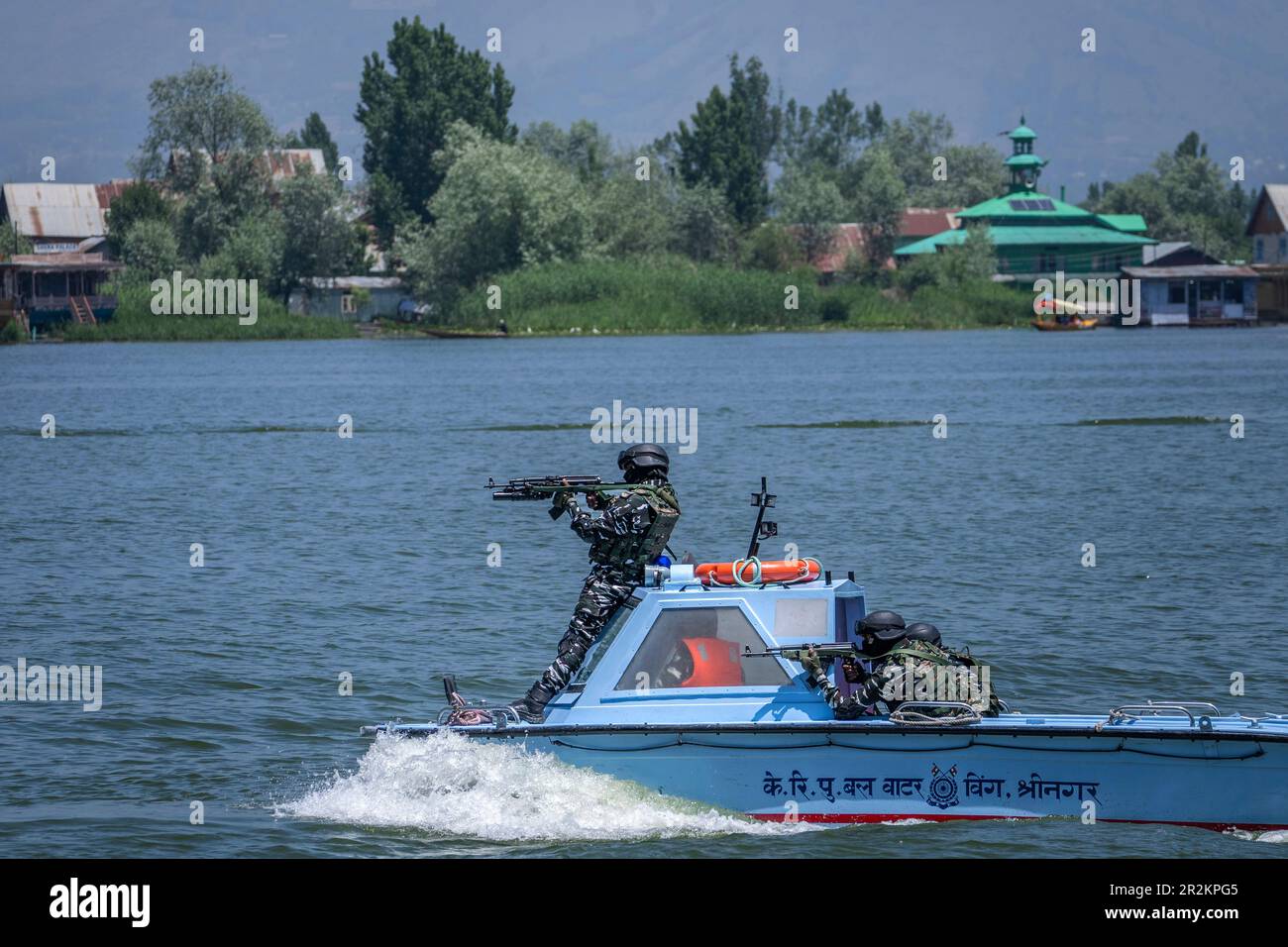Indian paramilitary soldiers patrol the Dal Lake ahead of the G20 tourism working group meeting ...