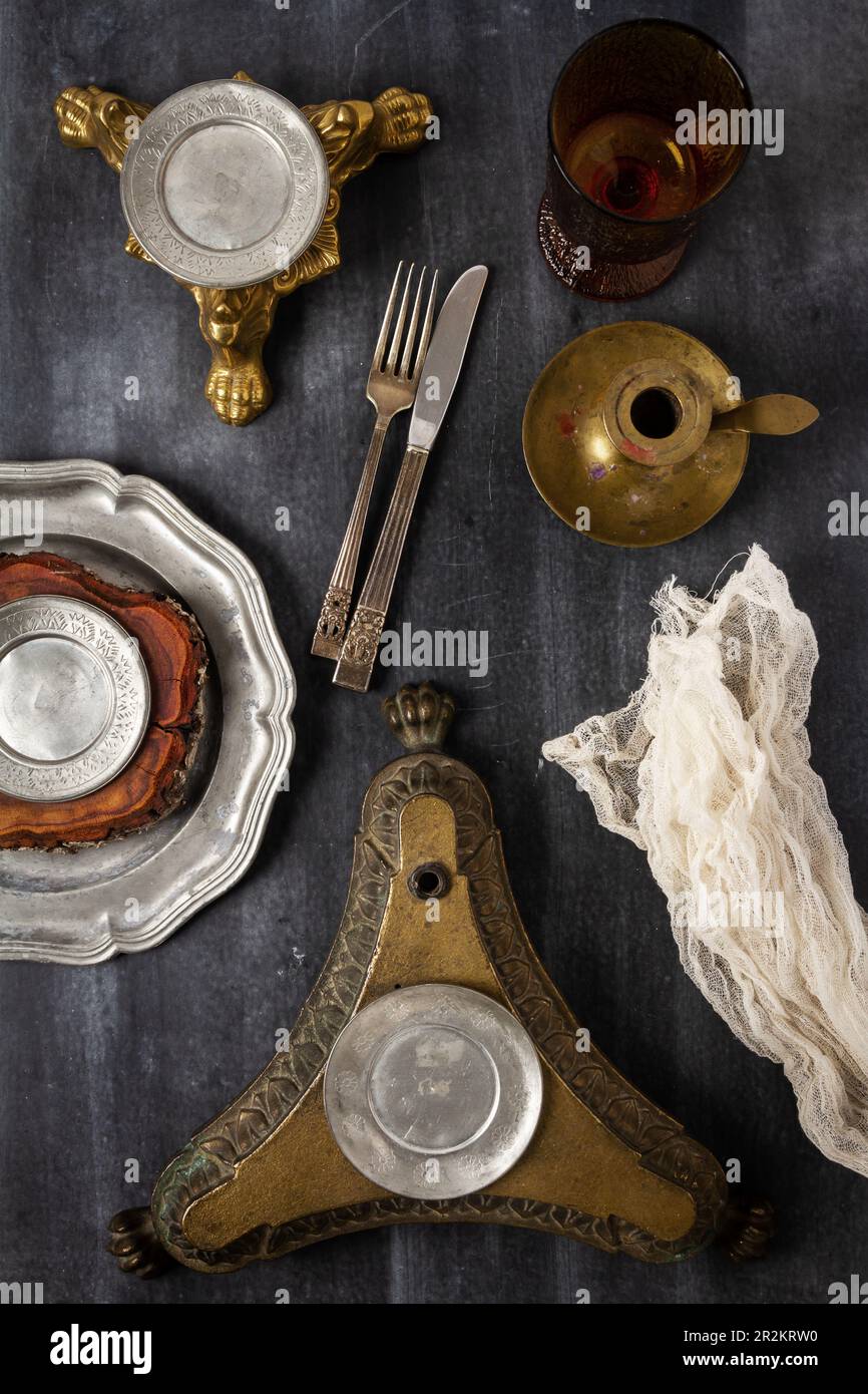Various antique objects on black chalkboard background. Flat lay. Top ...