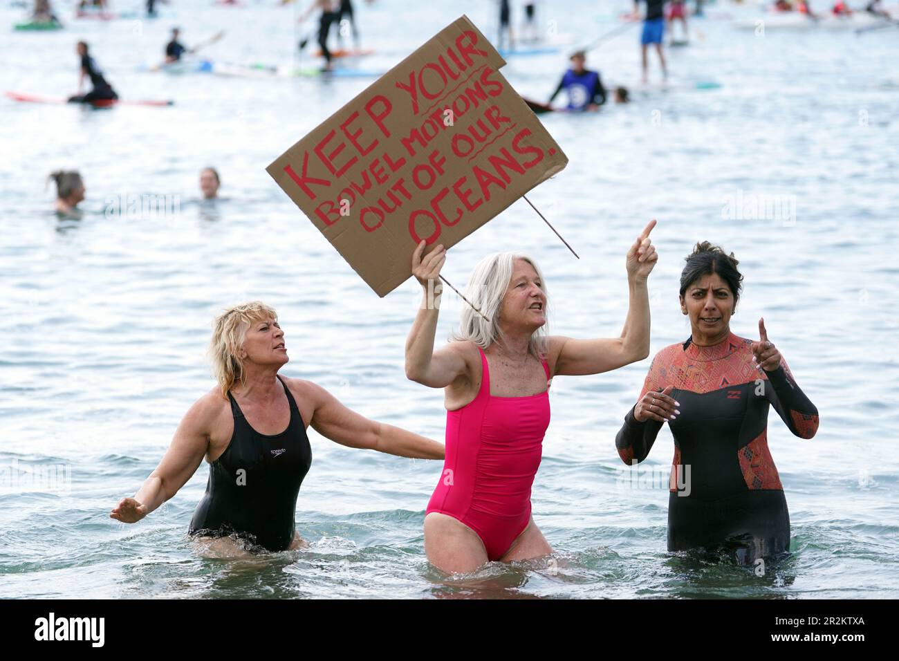 A woman holds up a placard as Surfers Against Sewage hold a UK-wide ...