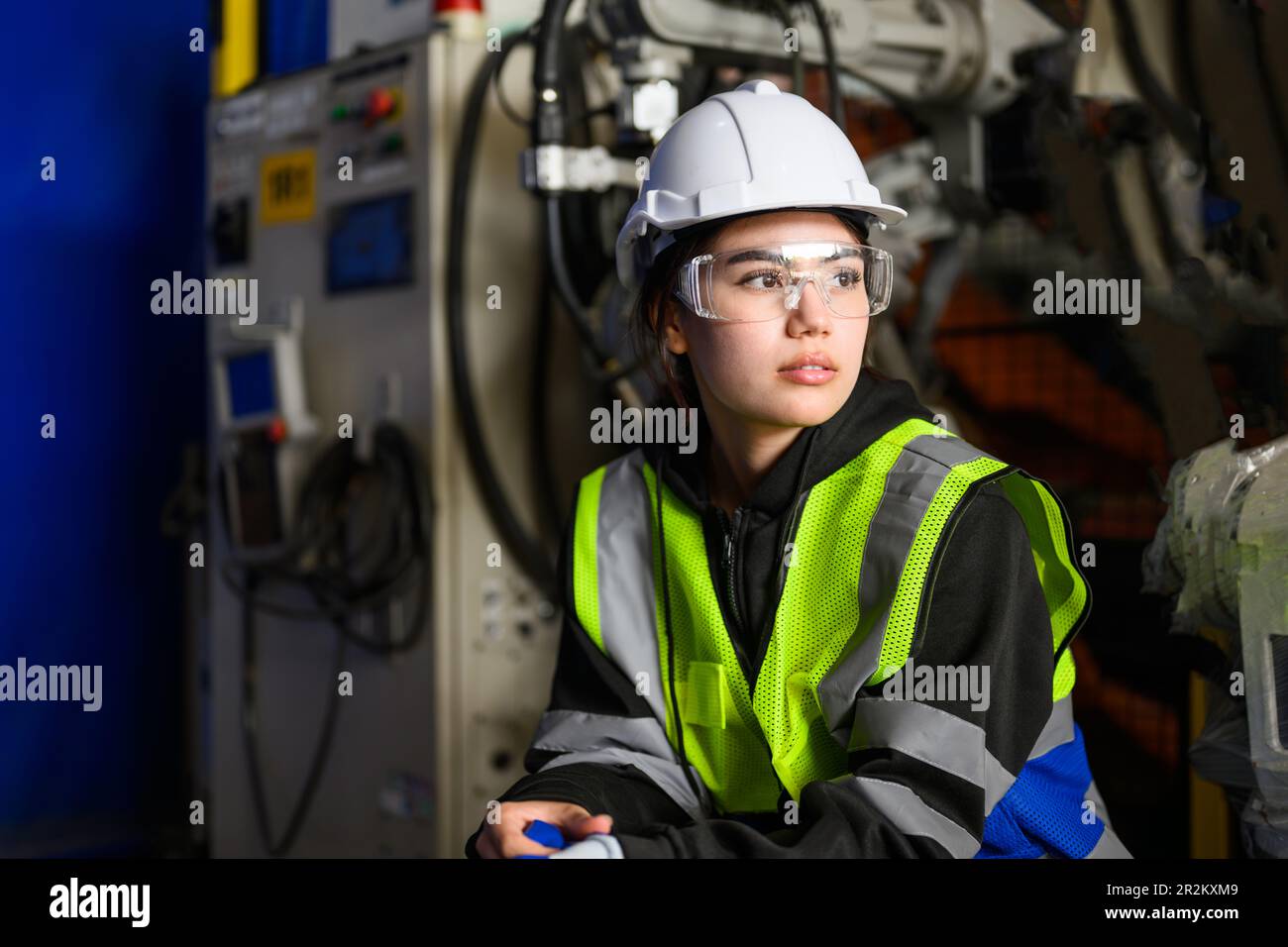 Professional maintenance worker working with robotic arms machine Stock ...