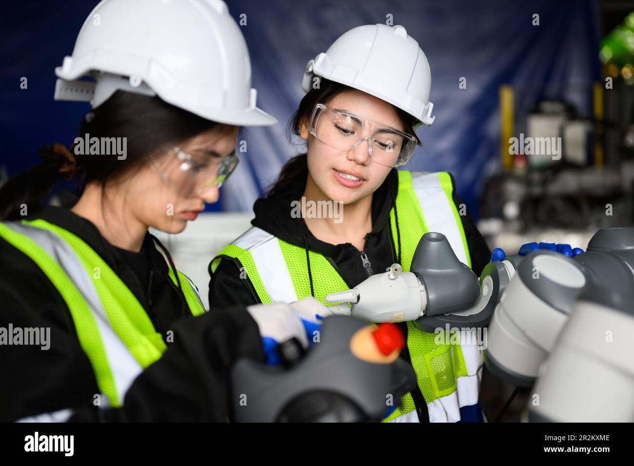 Female engineers maintenance robot arm hi-res stock photography and ...