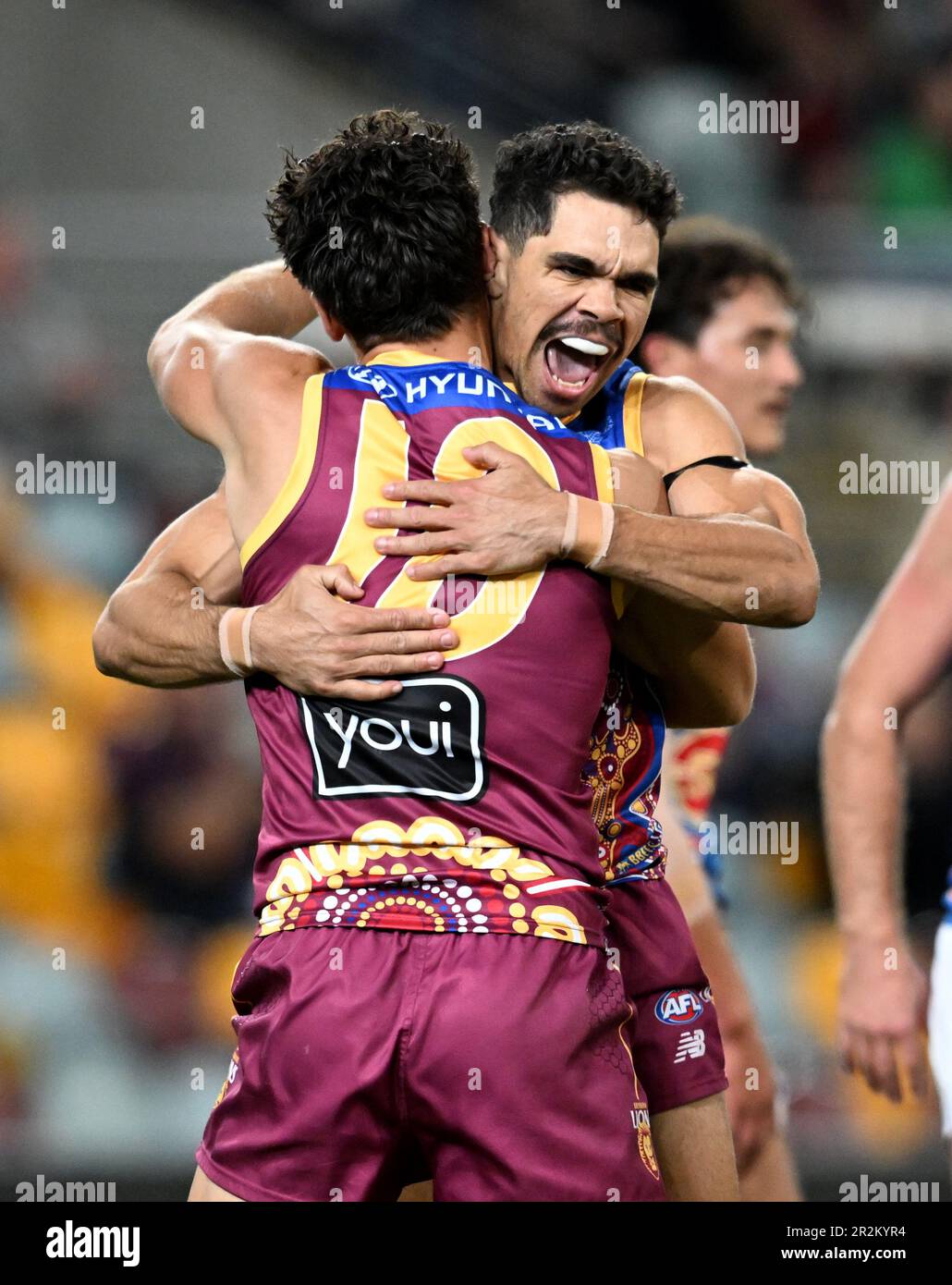 Charlie Cameron (right) of the Lions celebrates kicking a goal with Cam ...