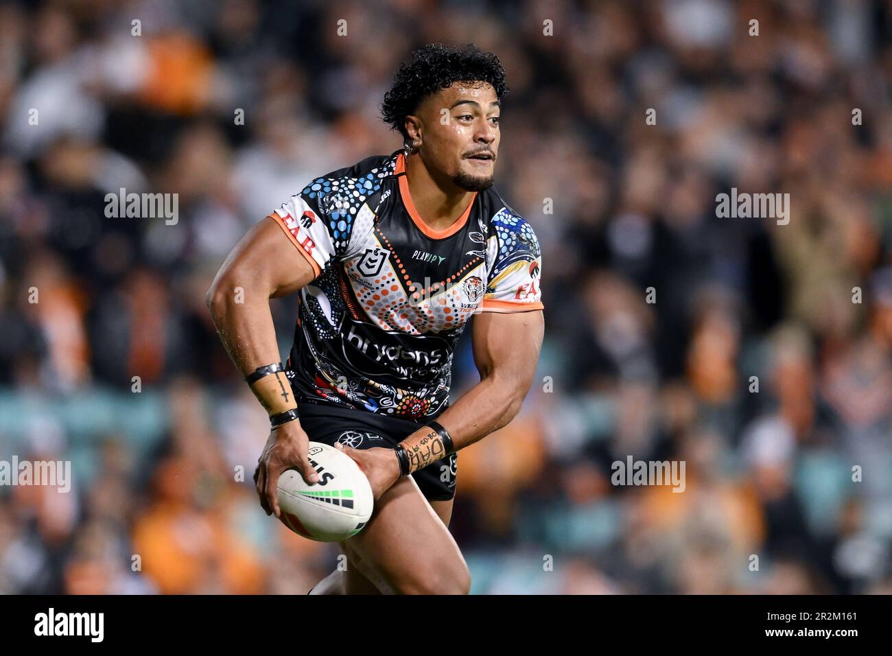 Fonua Pole of the Wests Tigers passes the ball during the NRL Round 12 ...