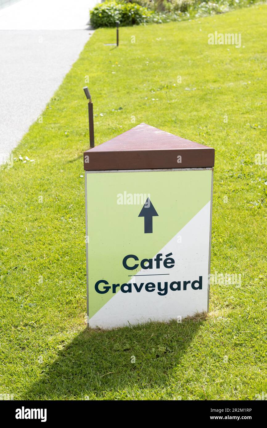 A sign pointing to Cafe and Graveyard, at Nano Nagle Place in Cork ...