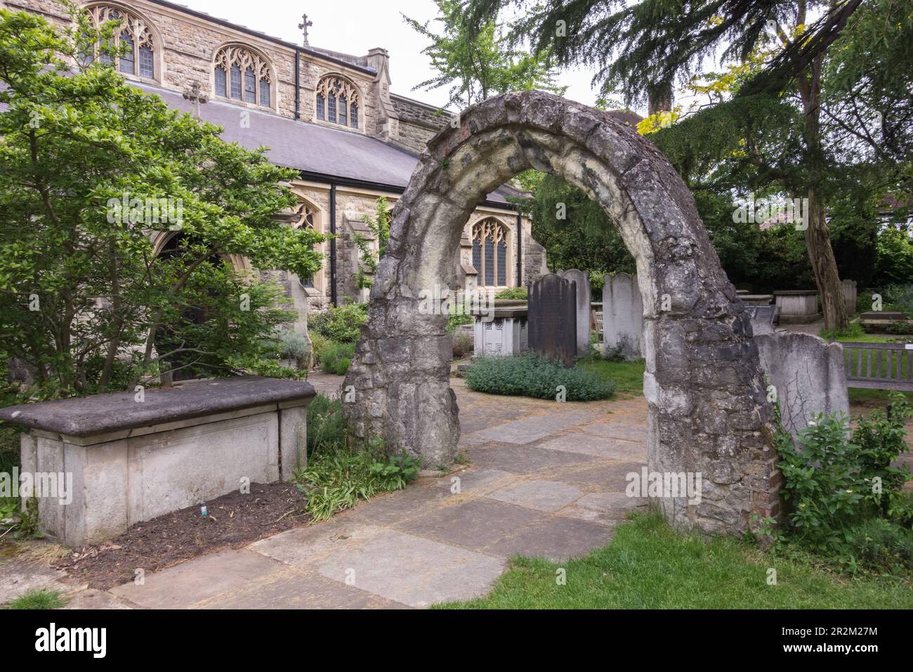 Ancient stone arch in the graveyard at St Mary the Virgin parish church ...