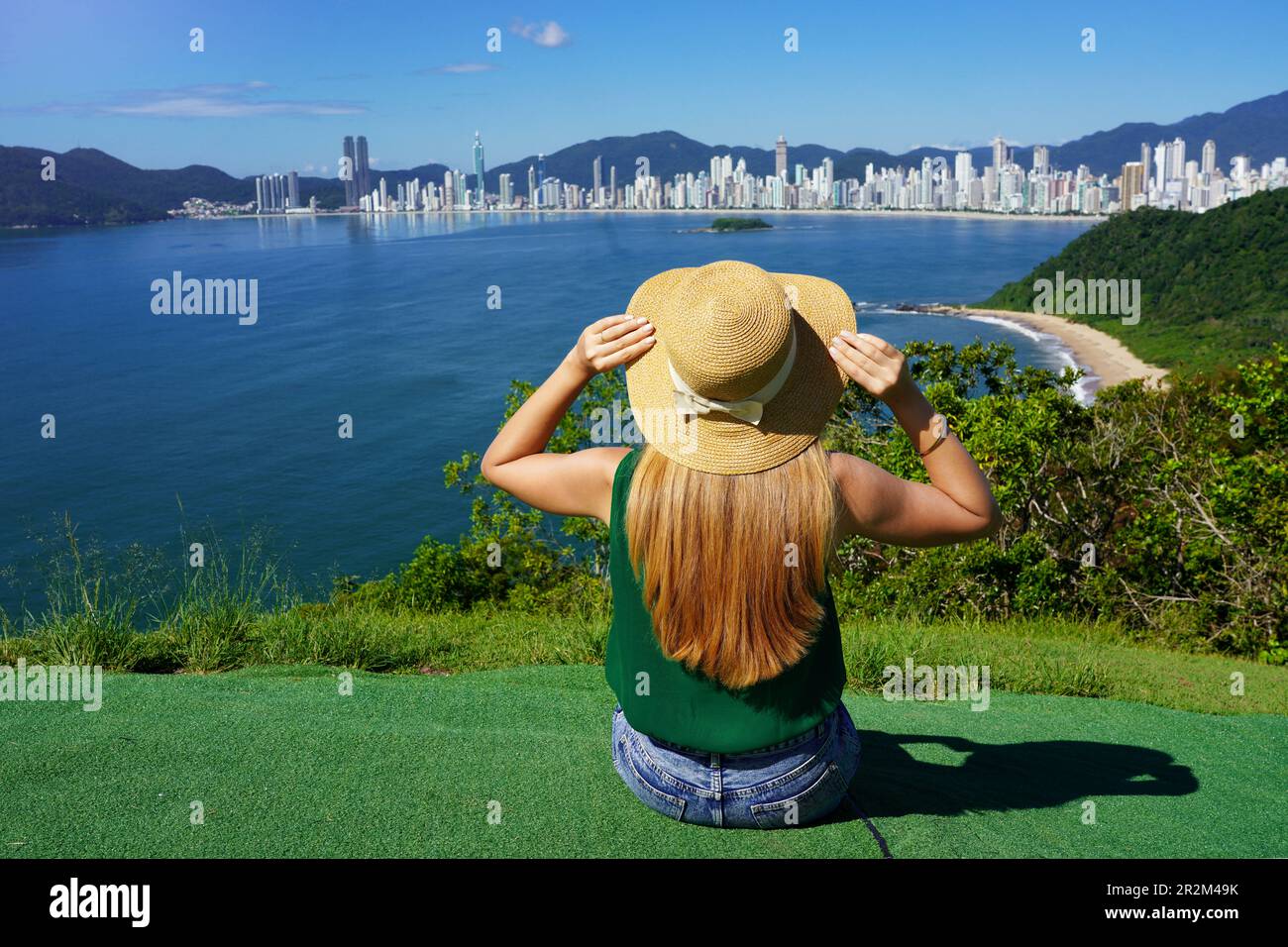 Holidays in Brazil. Traveler girl sitting on viewpoint enjoying ...
