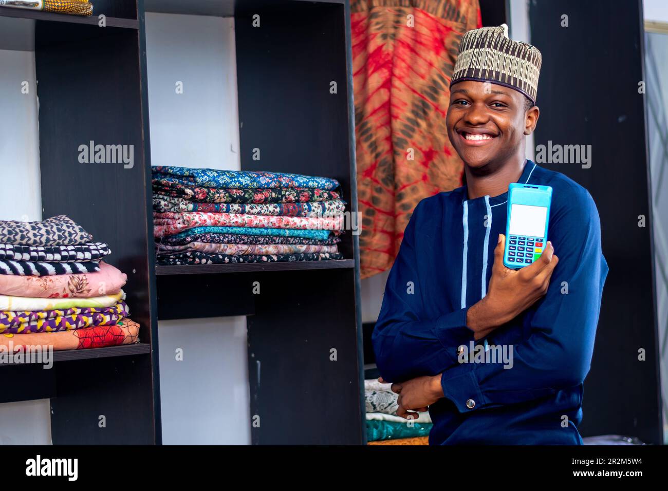 african businessman posing with a pos with arms crossed Stock Photo - Alamy