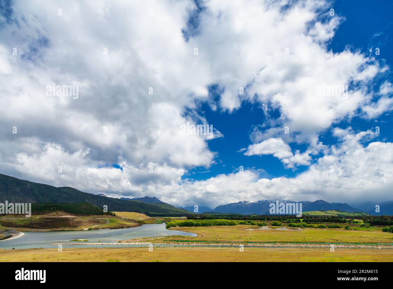 Dramatic sky over the Mararoa River, one of the braided rivers of the ...