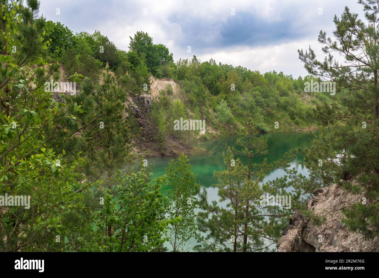 Lake was formed in an abandoned quarry. Gorgeous summer landscape with ...