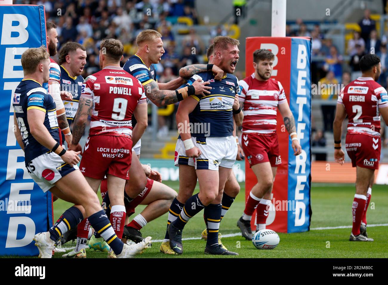 Leeds Rhino's Tom Holroyd celebrates his opening try during the Betfred ...