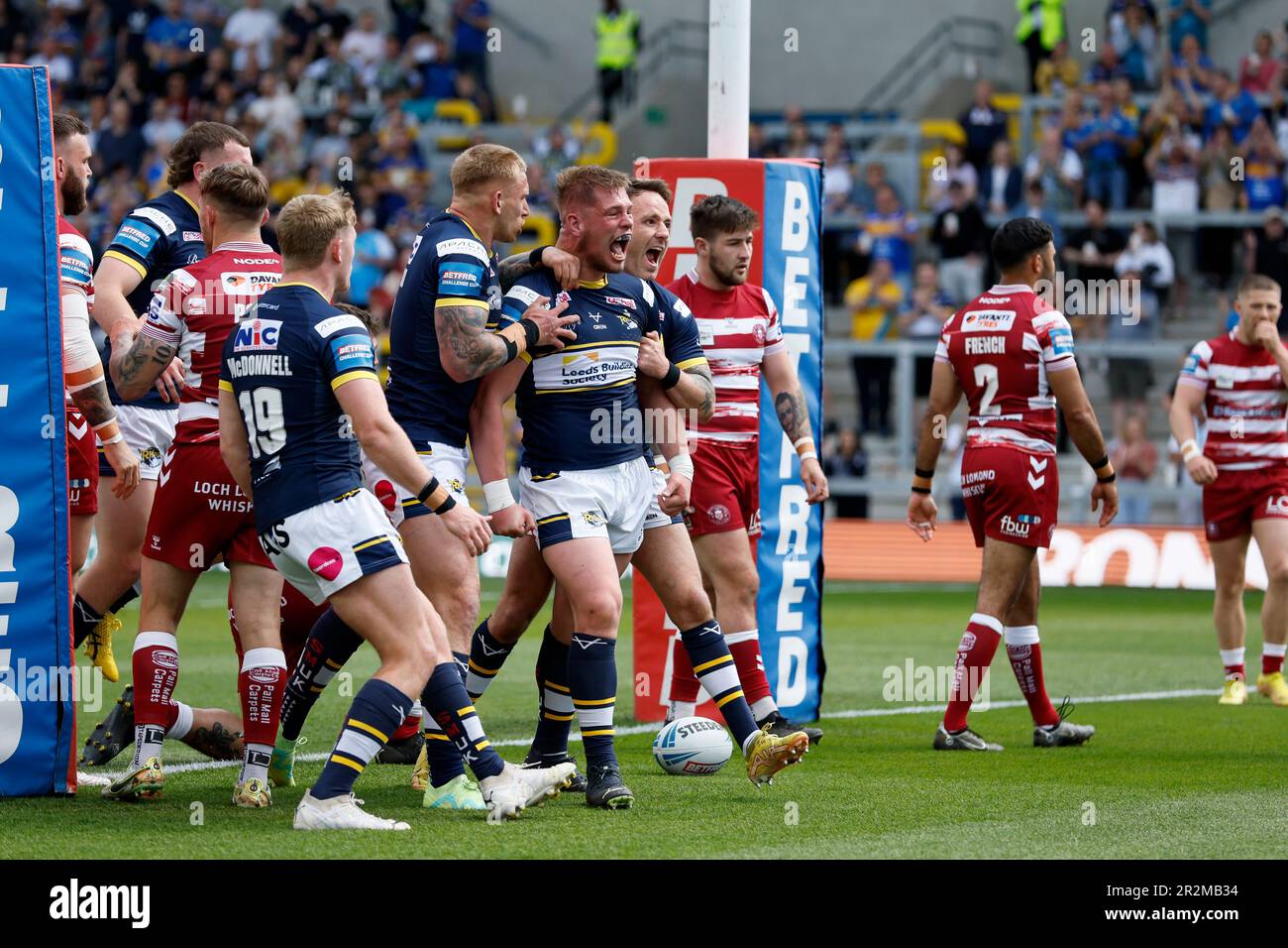 Leeds Rhino's Tom Holroyd celebrates his opening try during the Betfred ...
