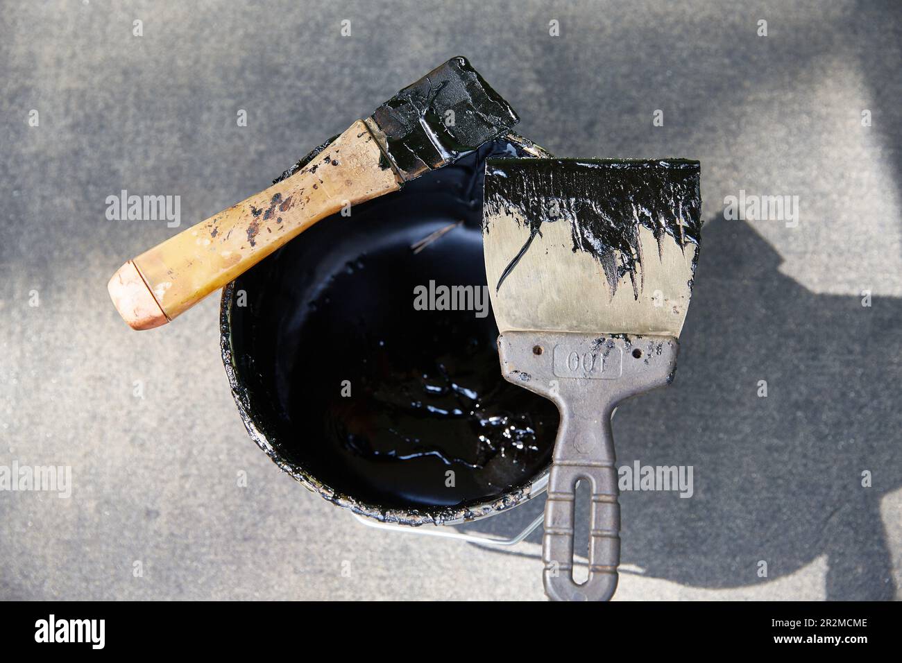Waterproofing mastic for the roof. Repair and construction Stock Photo ...