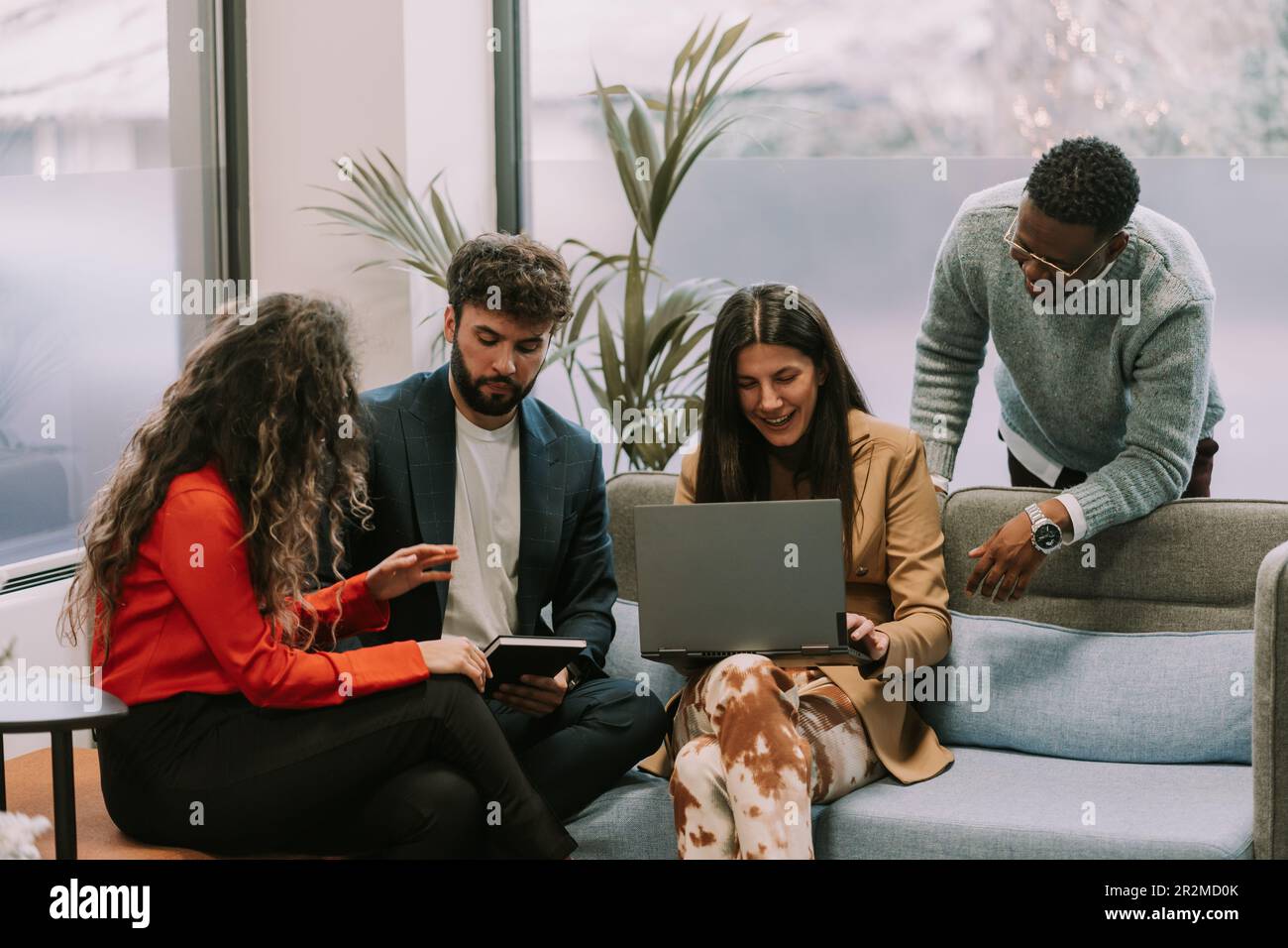 Beautiful multiracial couples working together at the office in a good ...