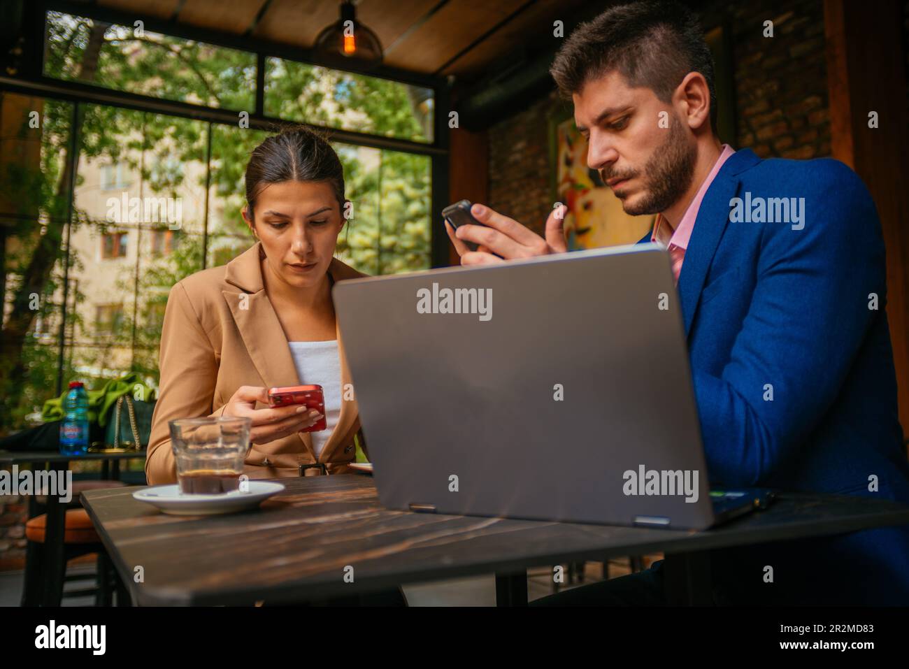 Two business guys took a break from their work. They are relaxing and ...