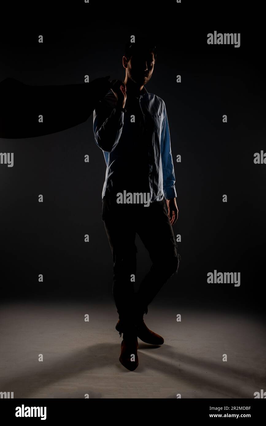Dimmed light man hi-res stock photography and images - Alamy