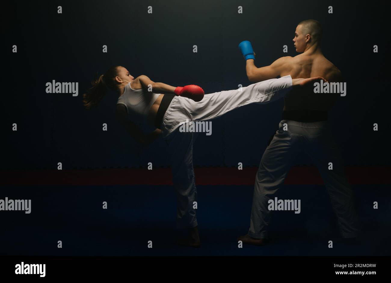 Strong girl fighting her friend with Ura Mawashi Geri pose at the ...