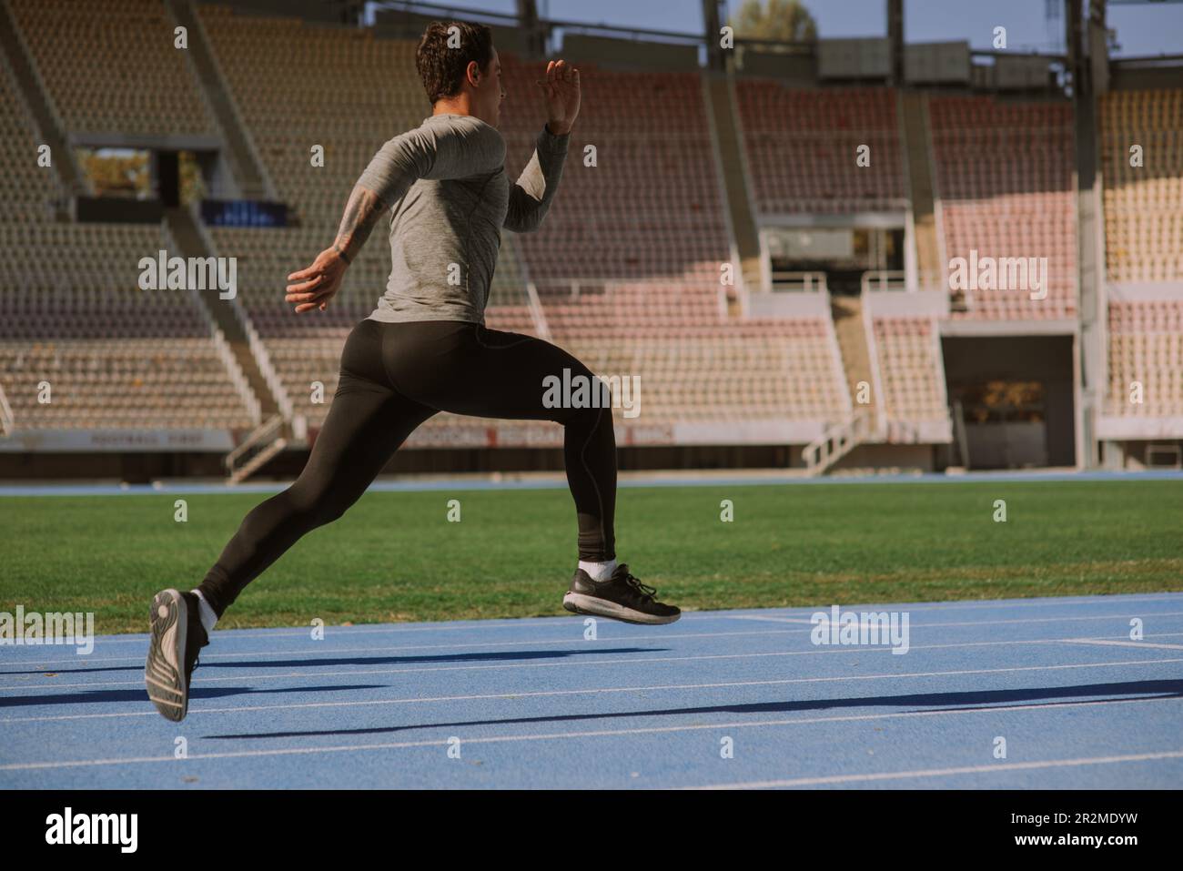 Sporty woman running up steps hi-res stock photography and images - Alamy