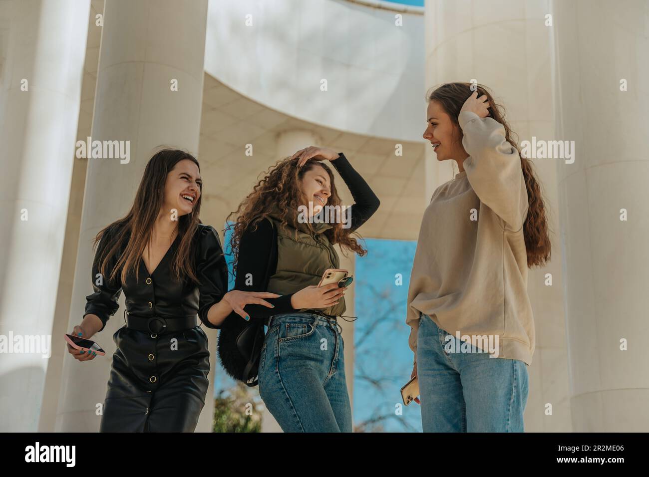 Brunette girl burst out laughing after she saw something funny on her ...