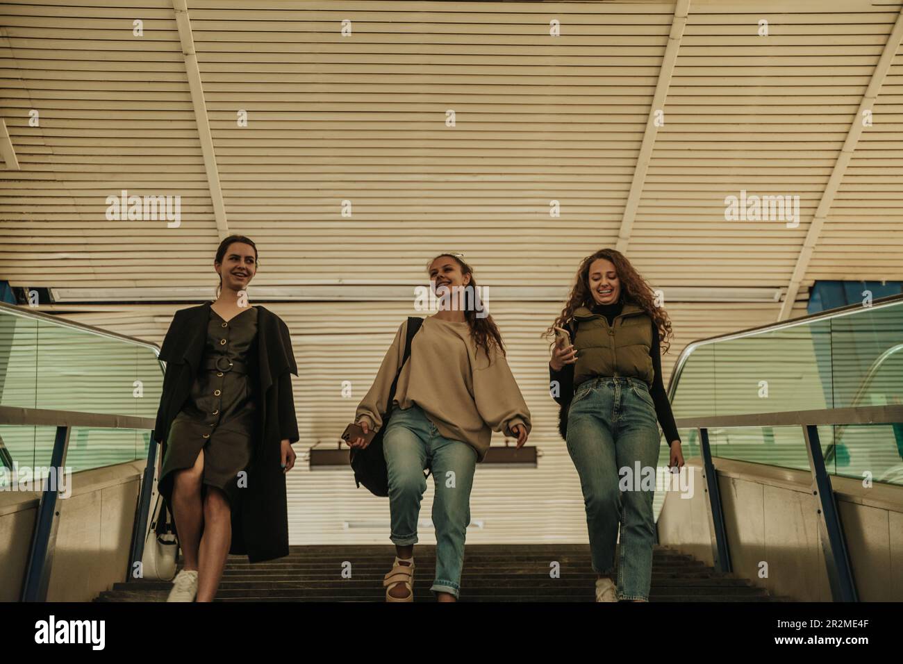 Smiley girls walking hi-res stock photography and images - Alamy