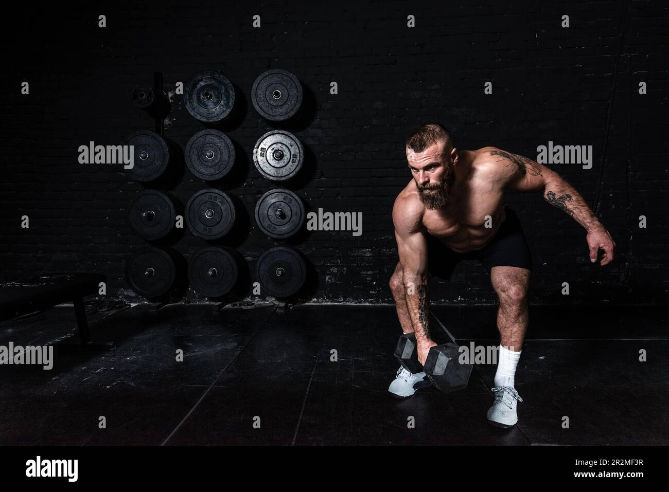 Young active strong sweaty focused fit muscular man with big muscles ...