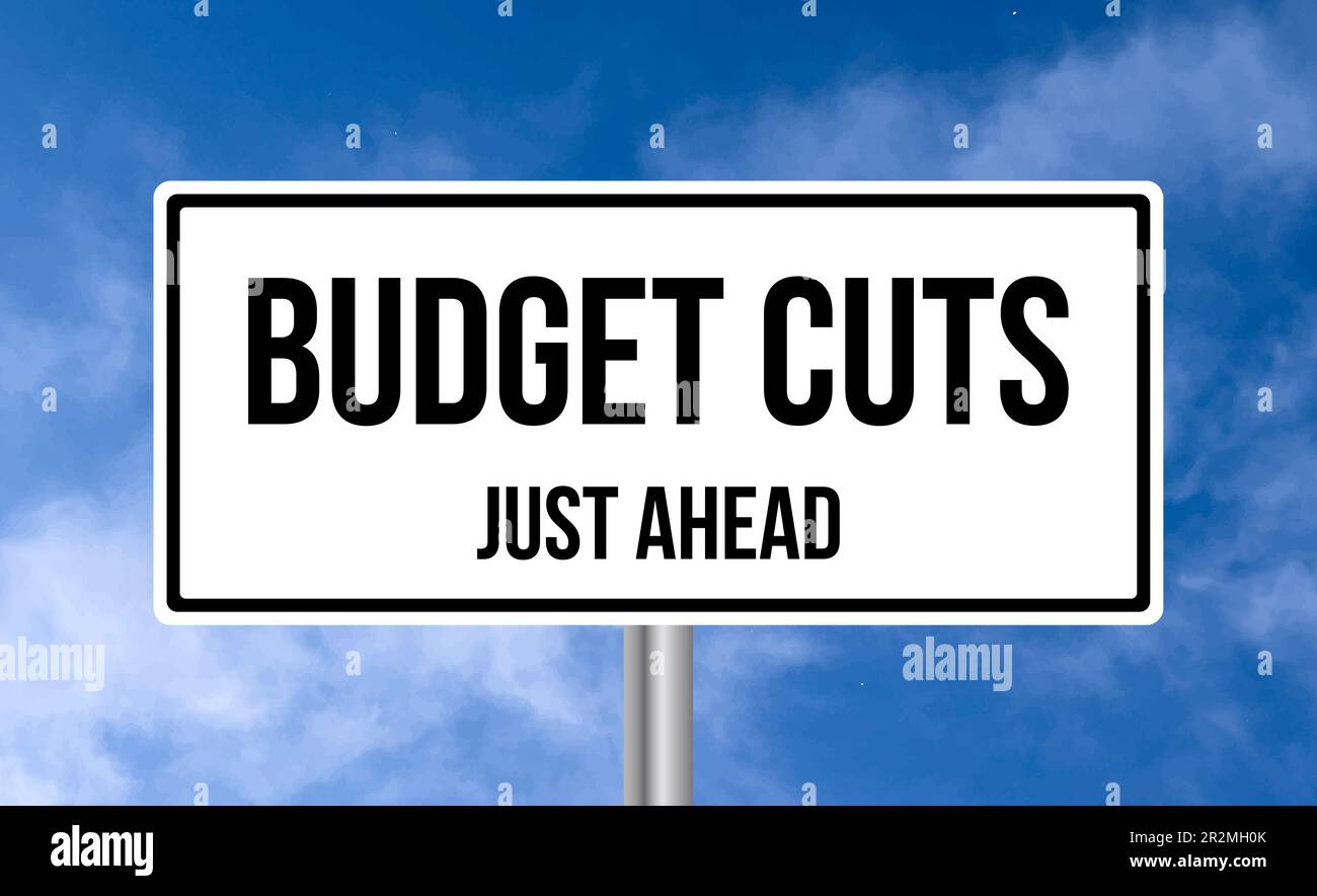 Budget Cuts just ahead road sign on sky background Stock Photo - Alamy