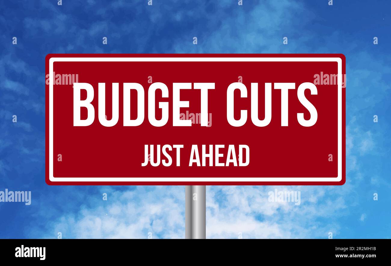 Budget Cuts just ahead road sign on sky background Stock Photo - Alamy