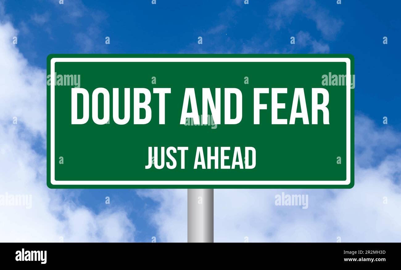 Doubt and Fear just ahead road sign on sky background Stock Photo - Alamy