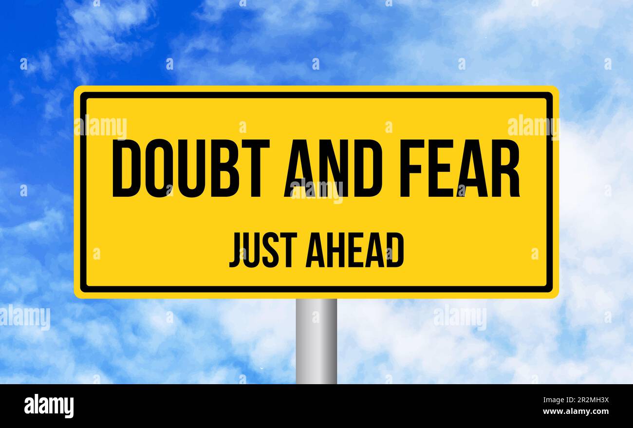 Doubt and Fear just ahead road sign on sky background Stock Photo - Alamy