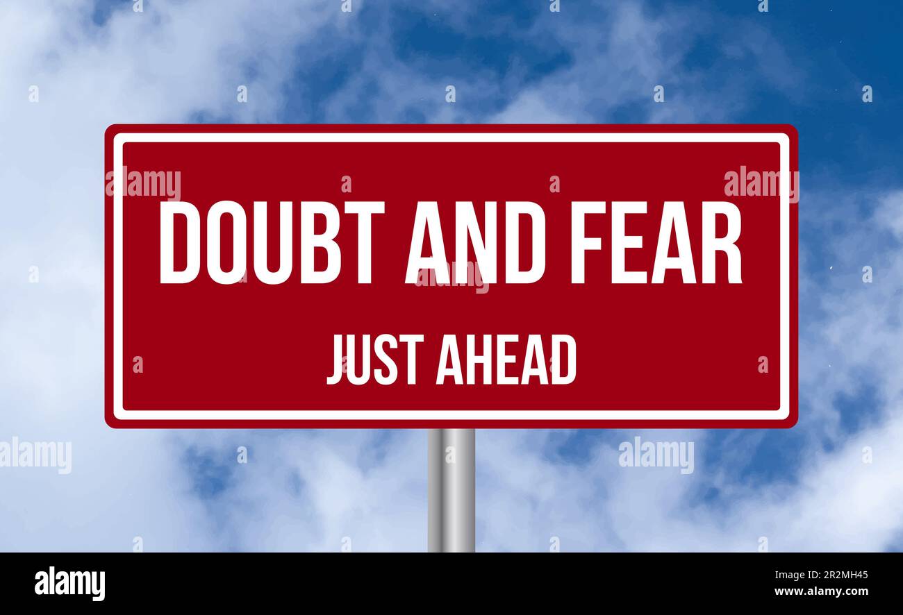 Doubt and Fear just ahead road sign on sky background Stock Photo - Alamy