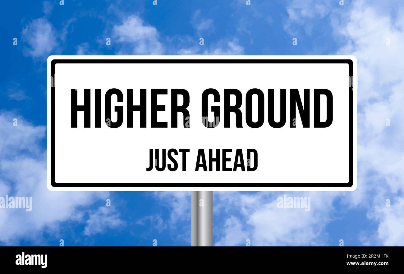 Higher Ground just ahead road sign on sky background Stock Photo - Alamy