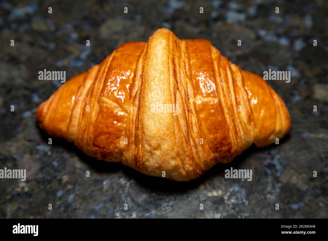 Golden brown butter croissant with shadow isolated on the plain ...