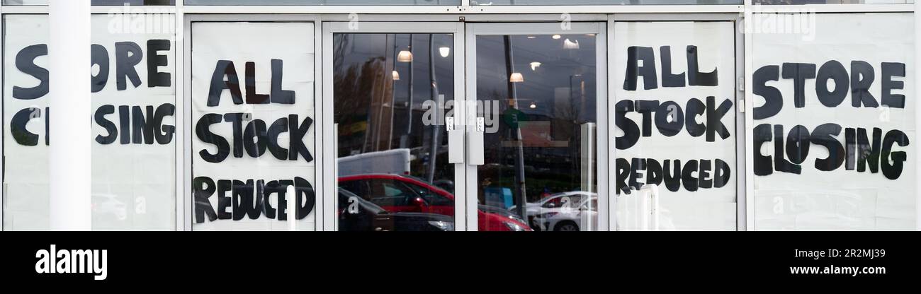 Store closing clearance sale now on sign in shop window Stock Photo - Alamy