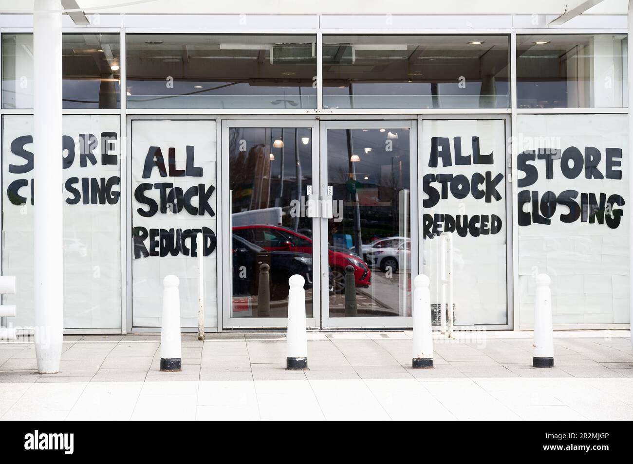 Store closing clearance sale now on sign in shop window Stock Photo - Alamy