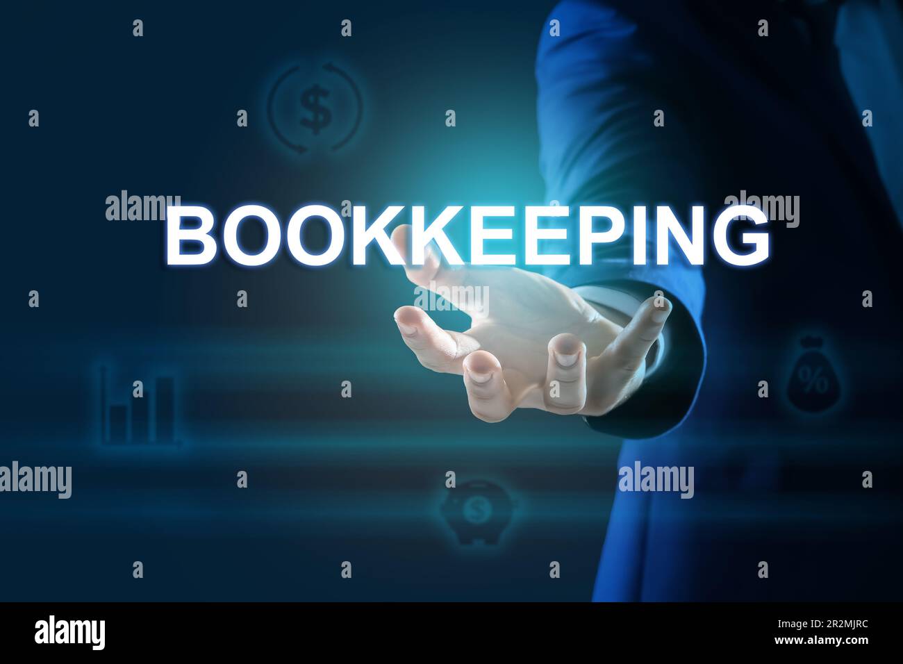 Bookkeeping concept. Businessman holding word on dark blue background ...