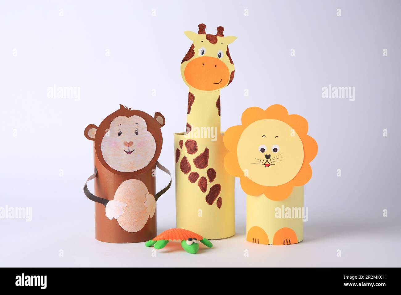 Toy monkey, giraffe and lion made from toilet paper hubs with ...