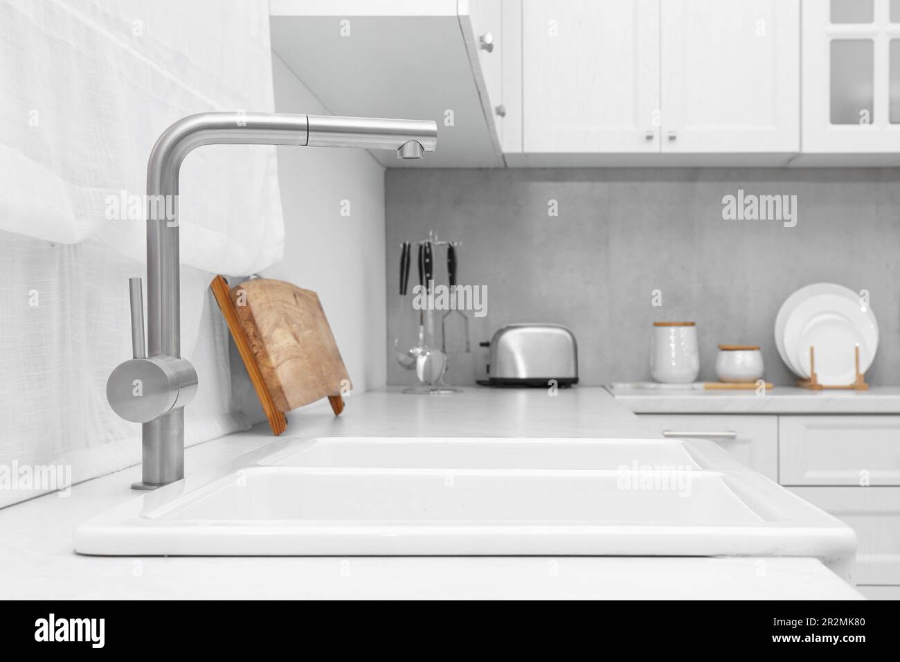 Modern sink and water tap in kitchen. Interior design Stock Photo - Alamy