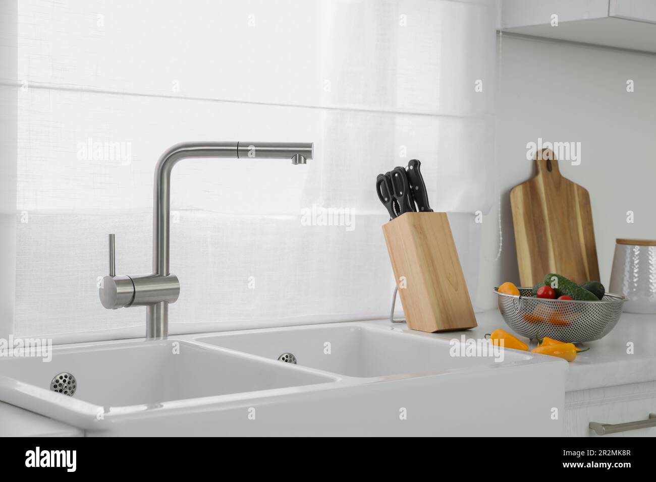 Modern sink and water tap on kitchen counter. Interior design Stock ...