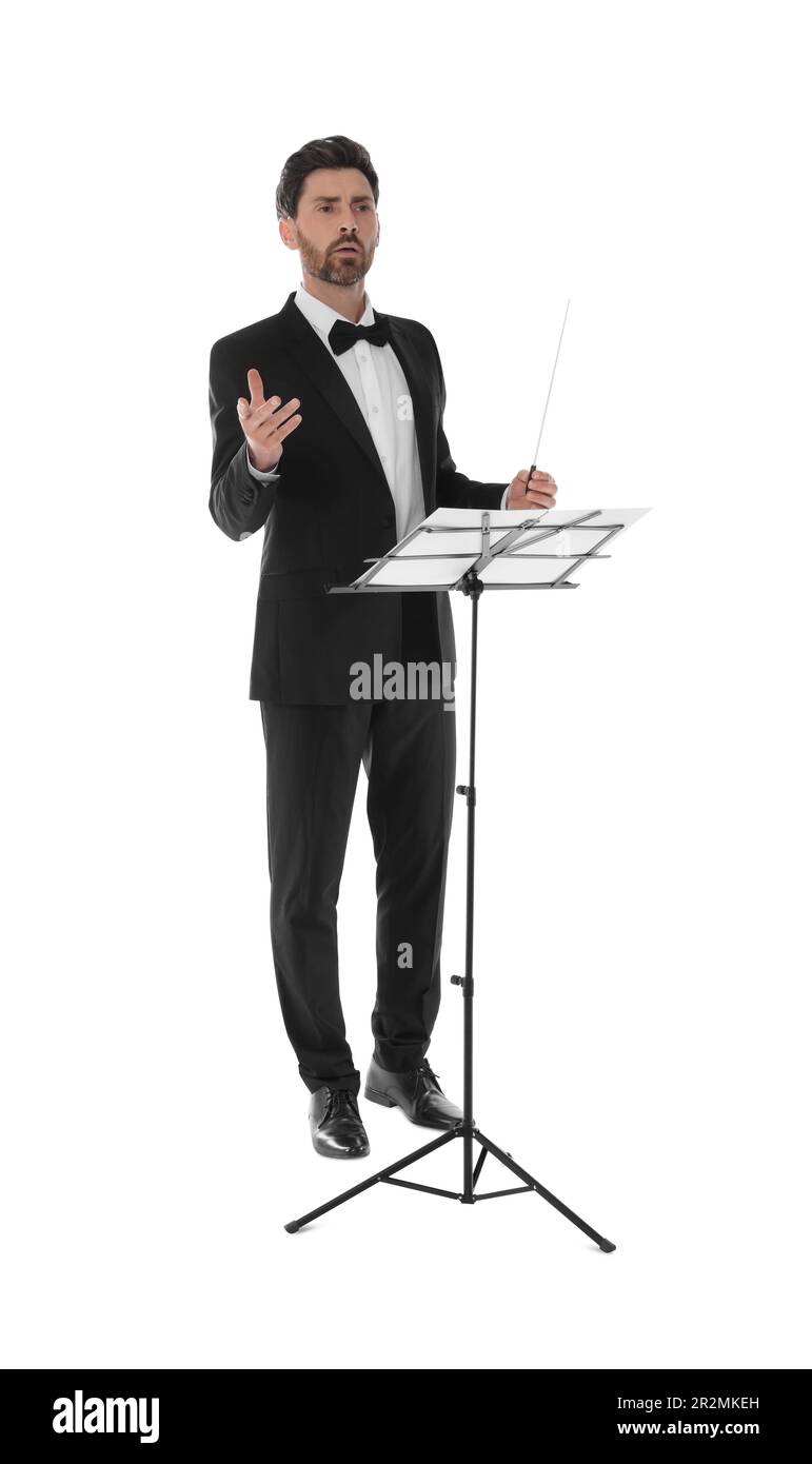 Professional conductor with baton and note stand on white background ...