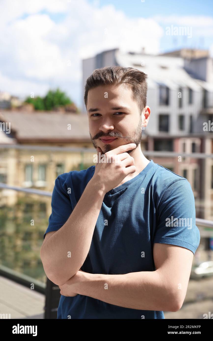 Man touching clothes outside hi-res stock photography and images - Alamy