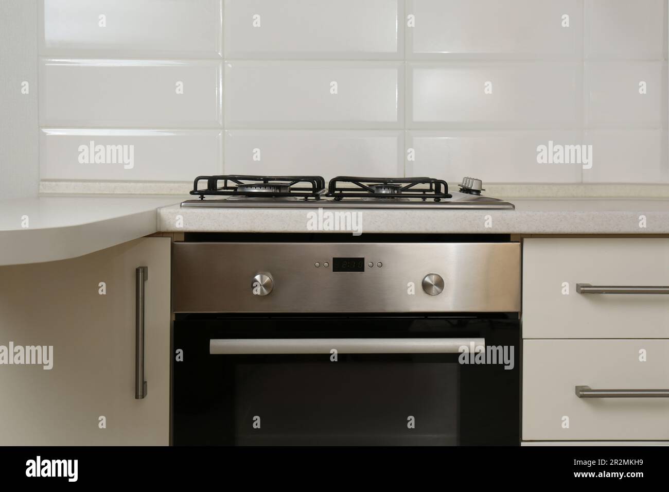 New gas stove and oven in stylish kitchen Stock Photo - Alamy