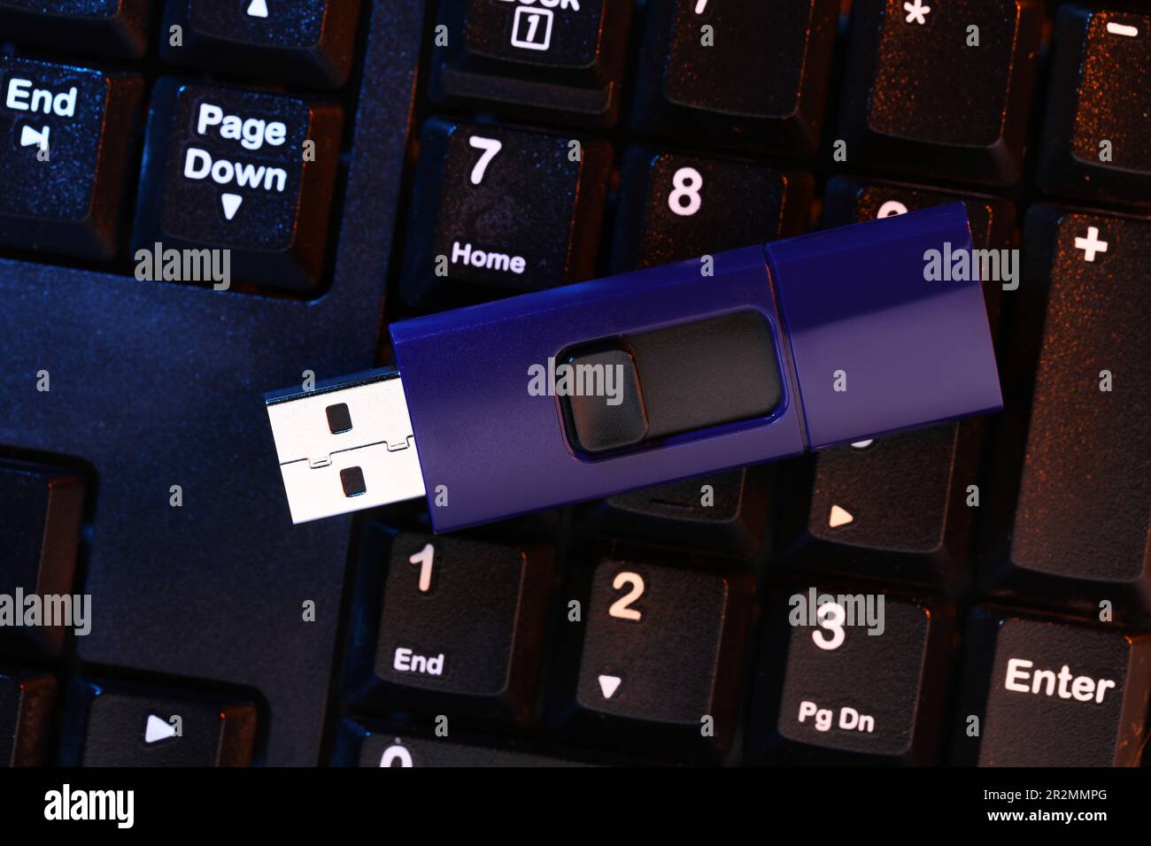 Modern usb flash drive on computer keyboard, top view Stock Photo - Alamy