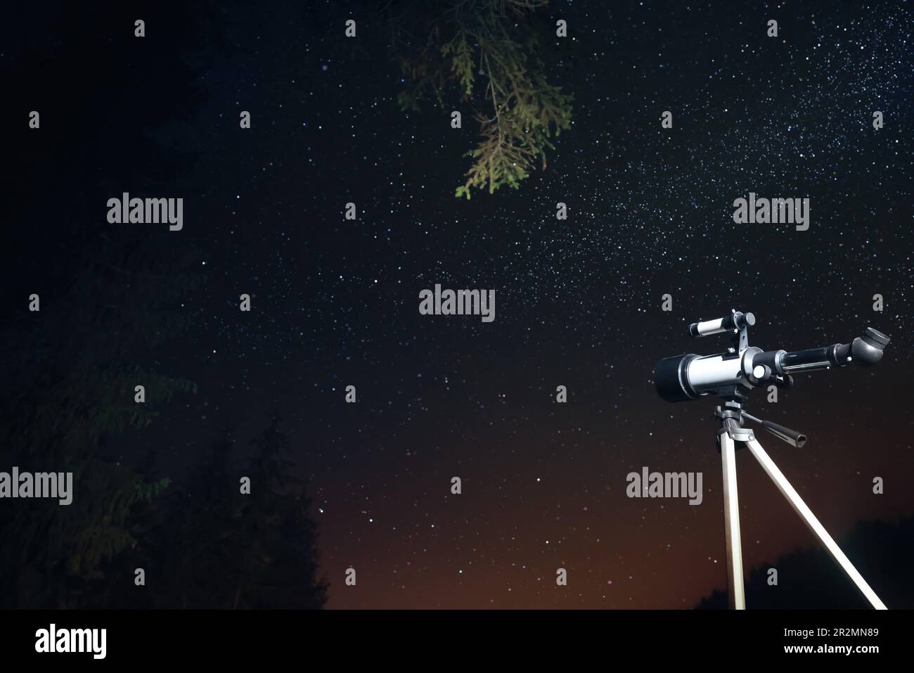 Modern telescope and beautiful sky in night outdoors. Learning ...