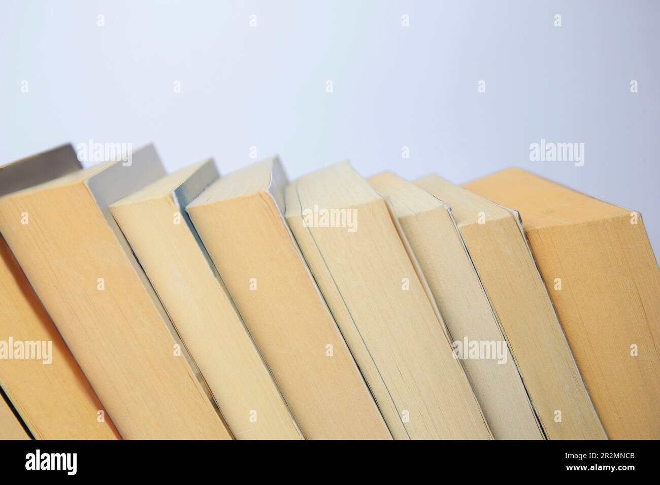 Collection of different books on light background Stock Photo - Alamy