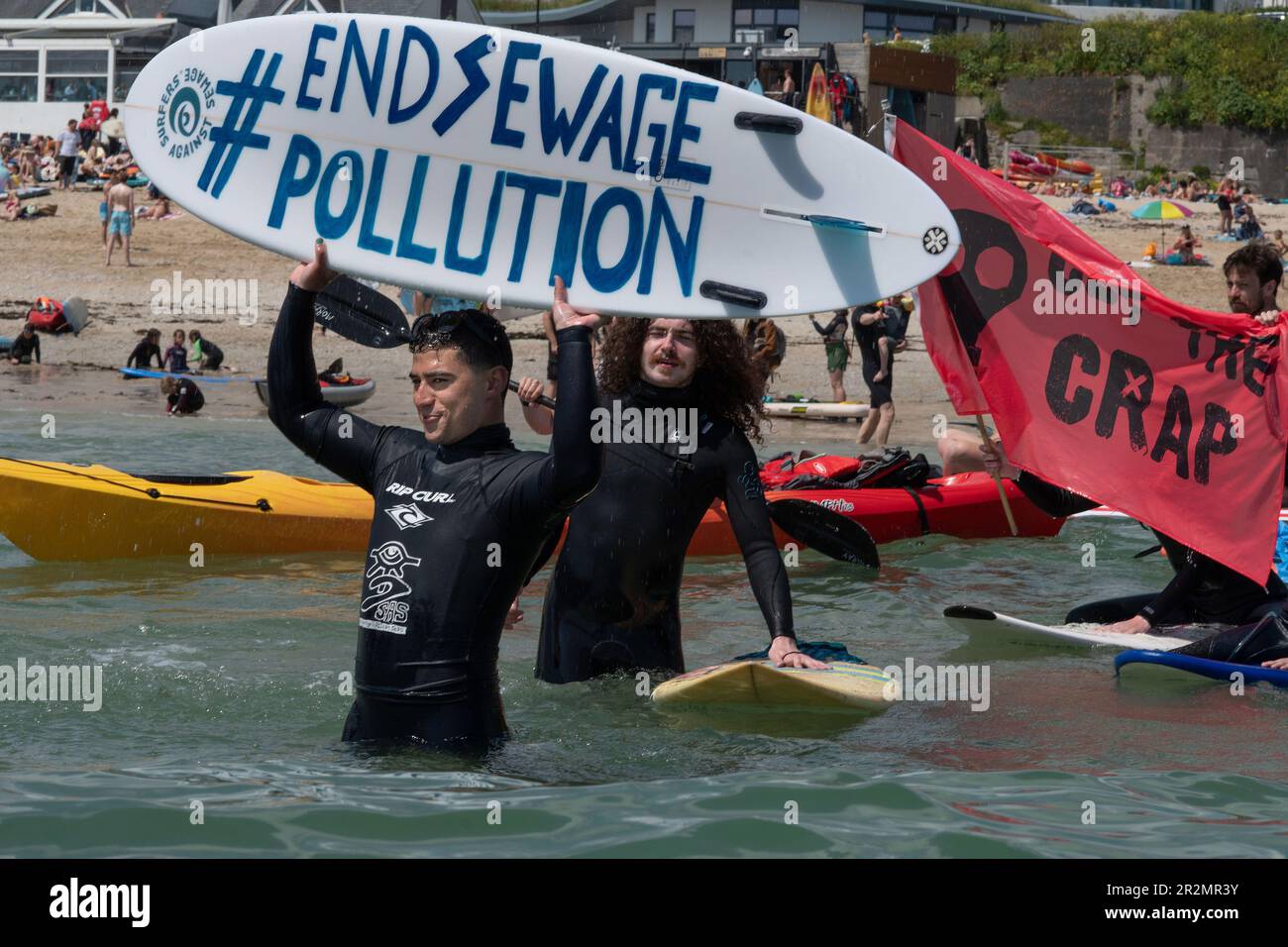 EDITORIAL USE ONLY Members of the public attend a paddle-out protest ...